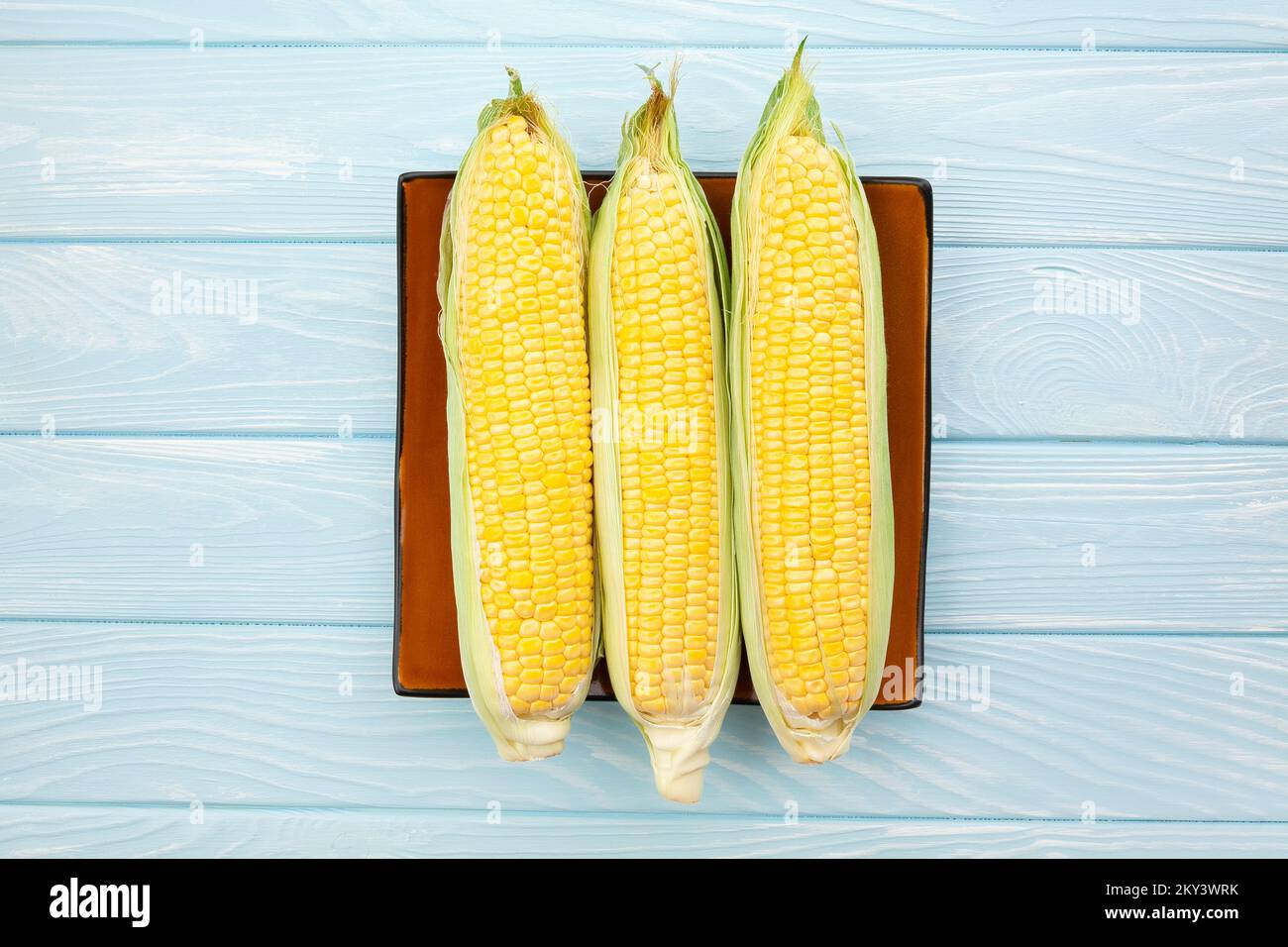 corn group on wood background top view Stock Photo - Alamy