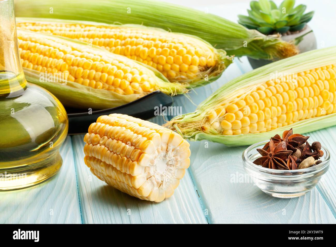 sliced corn on wood background Stock Photo - Alamy