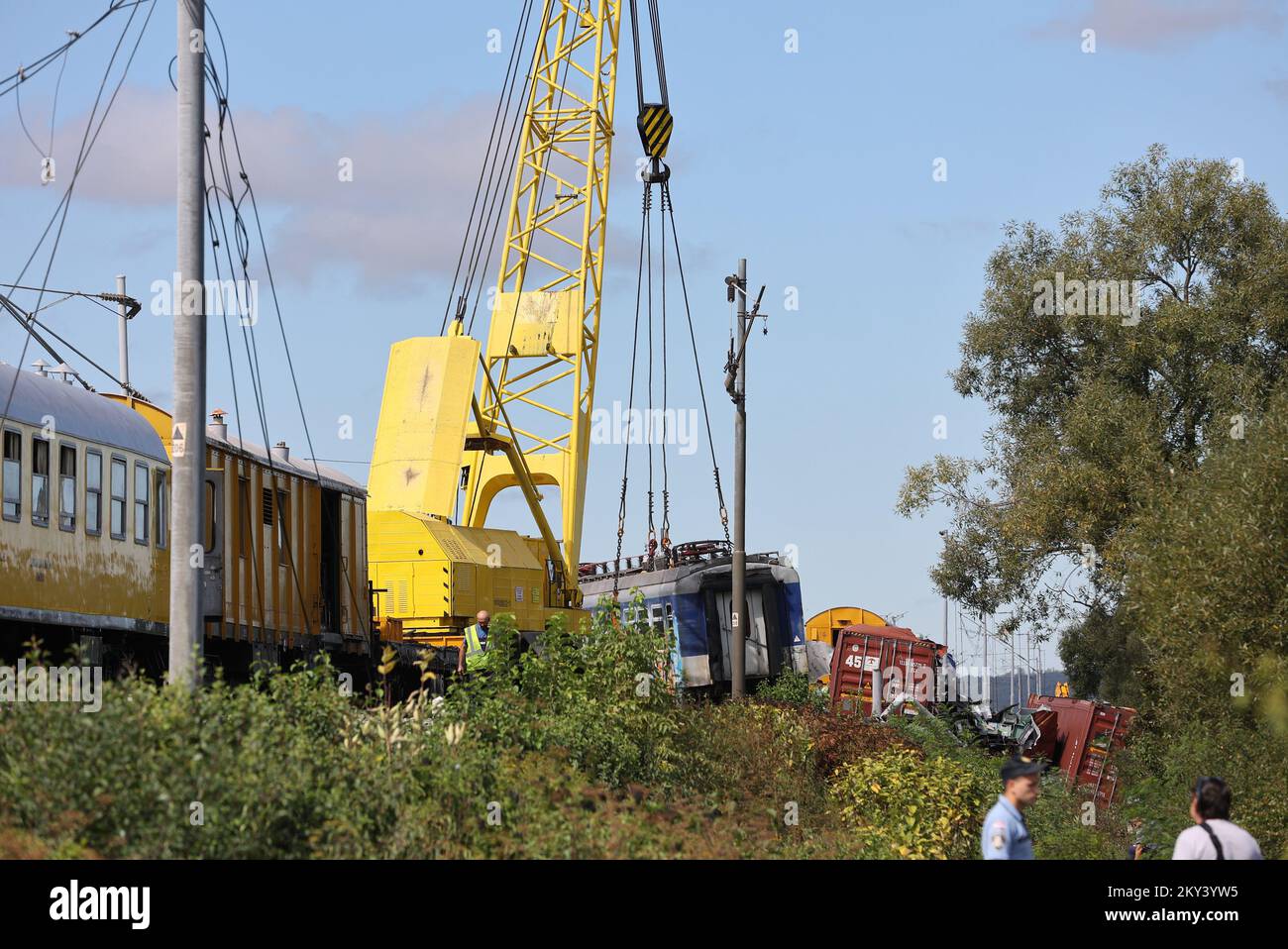 A train compartment is lifted by a crane at the site of an train ...