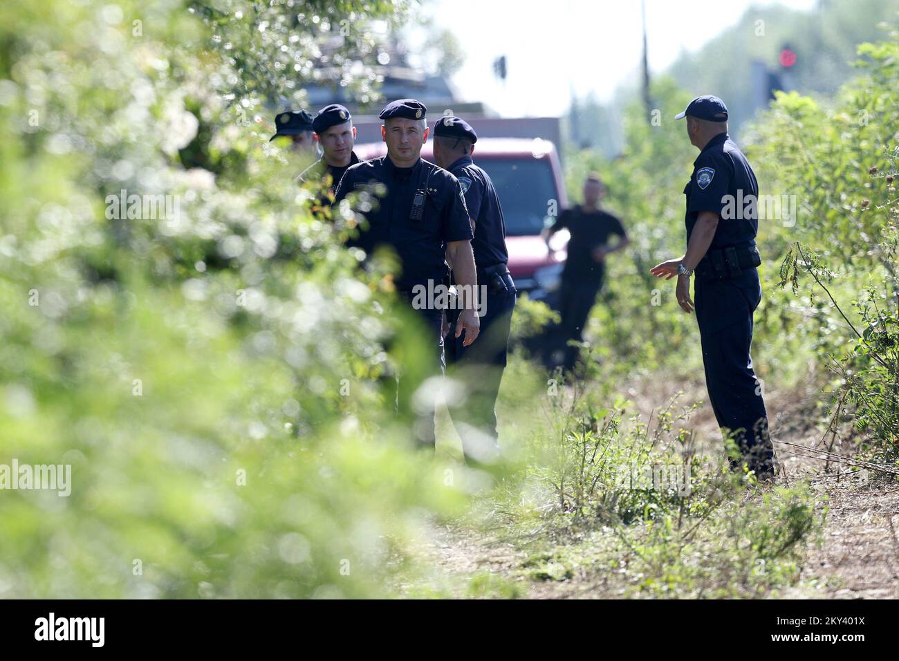 Rescue workers work at the crash site where two trains collided in ...