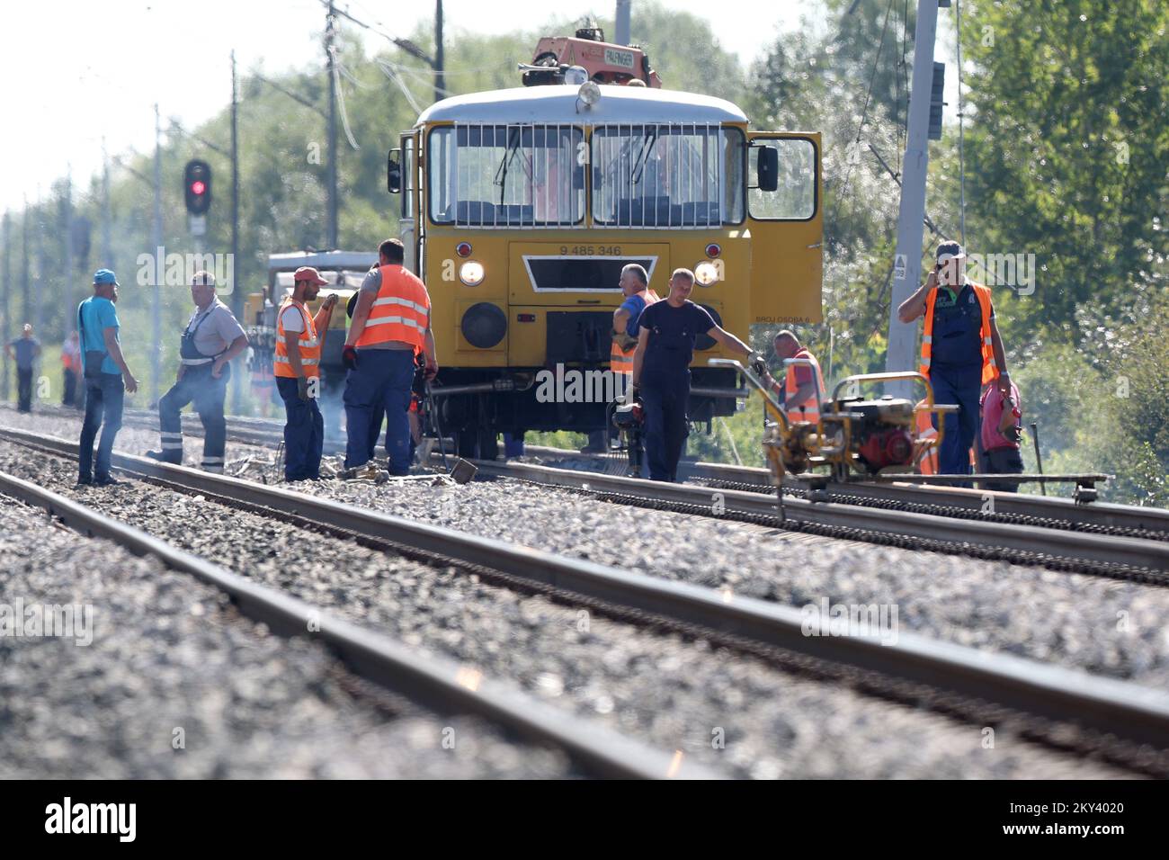 Rescue workers work at the crash site where two trains collided in ...