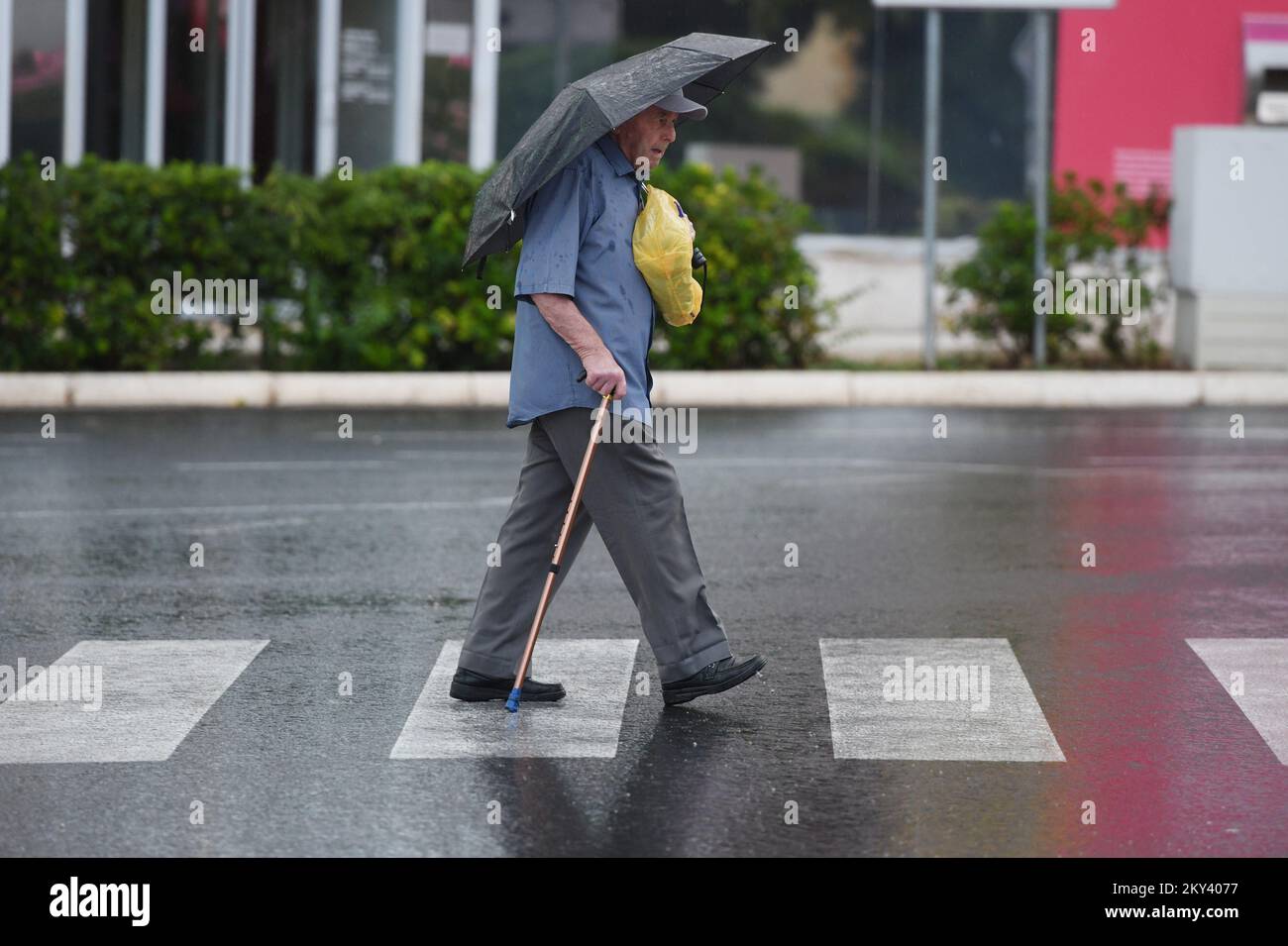 Rainy morning on the city streets in Sibenik, Croatia on September 11 ...