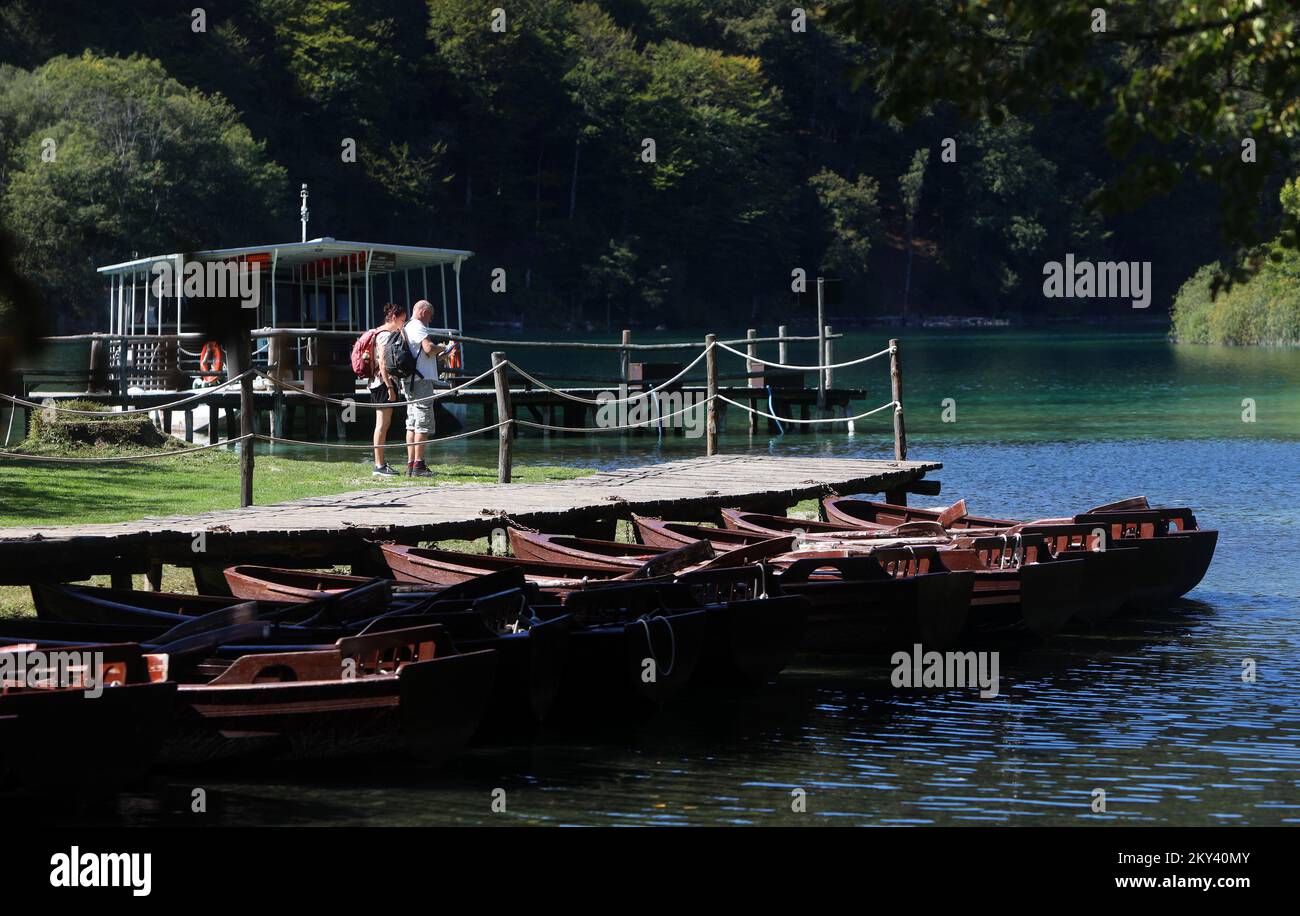 Tourists enjoy at the Plitvice Lakes National Park in Croatia, on ...