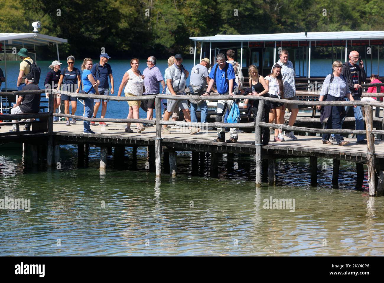 Tourists enjoy at the Plitvice Lakes National Park in Croatia, on ...