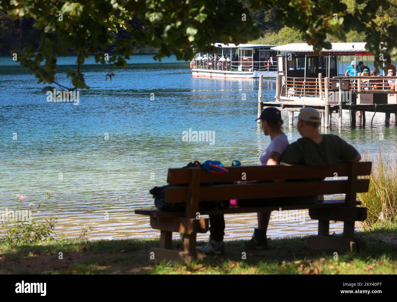 Tourists enjoy at the Plitvice Lakes National Park in Croatia, on ...