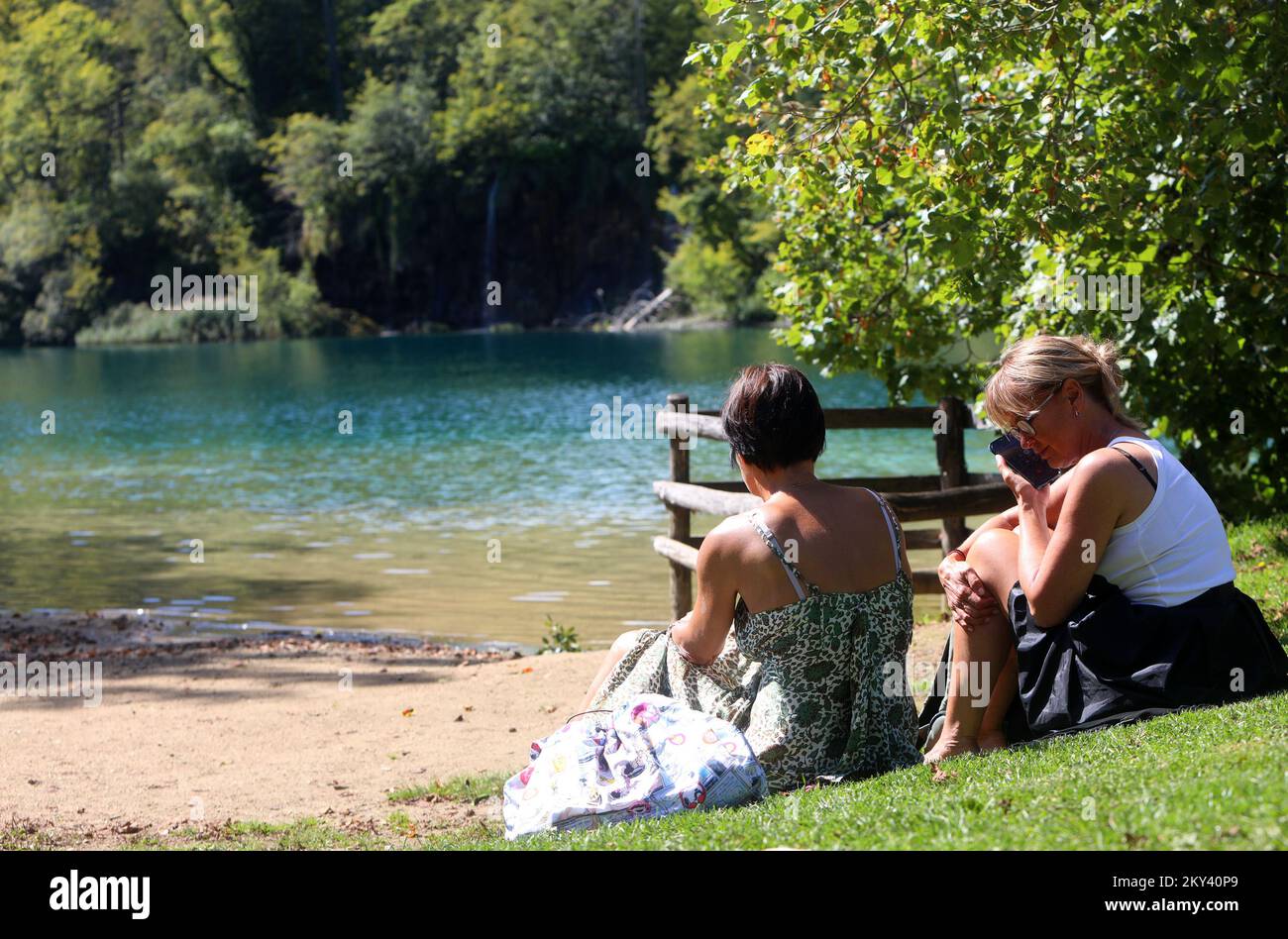 Tourists enjoy at the Plitvice Lakes National Park in Croatia, on ...