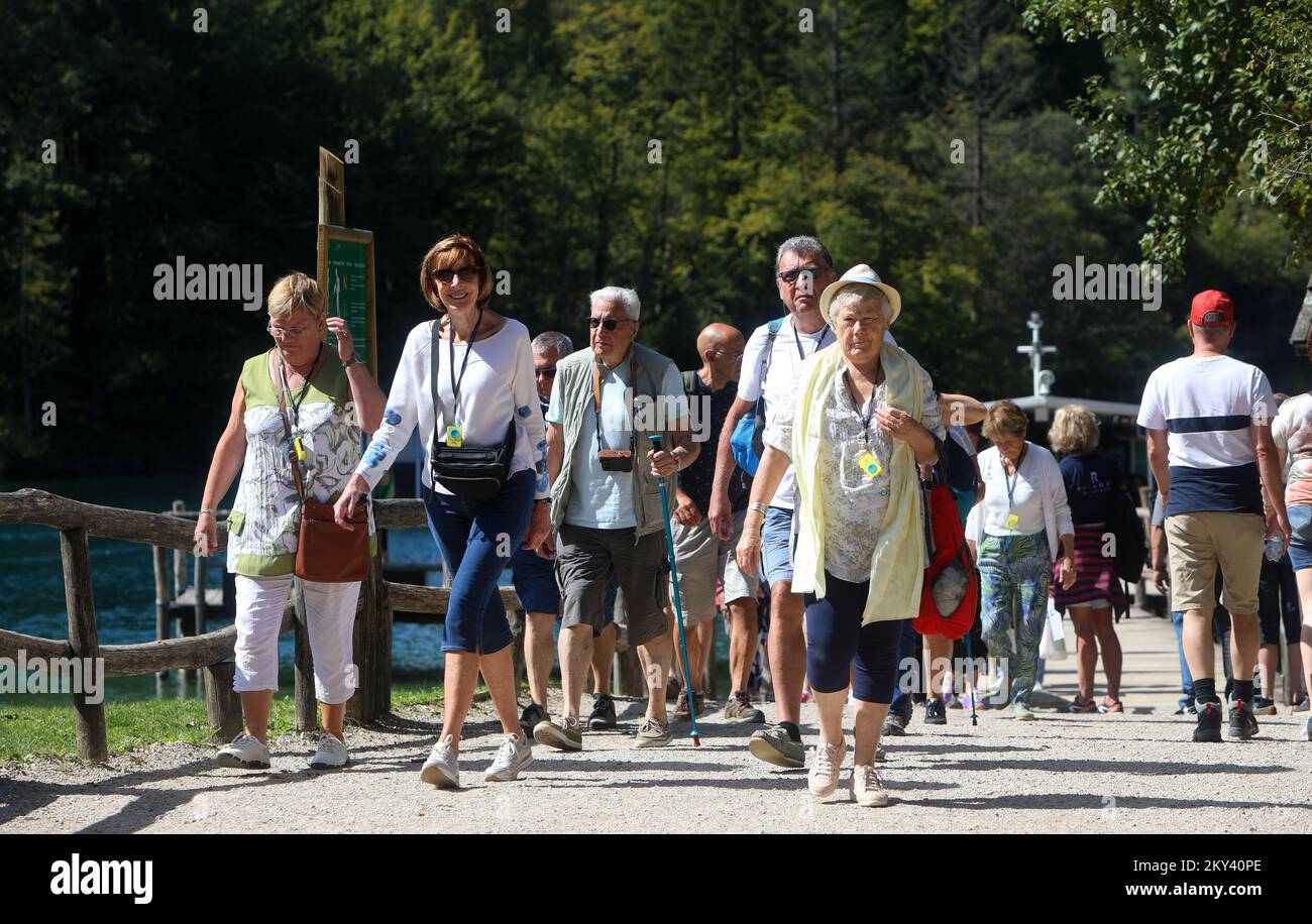 Tourists enjoy at the Plitvice Lakes National Park in Croatia, on ...