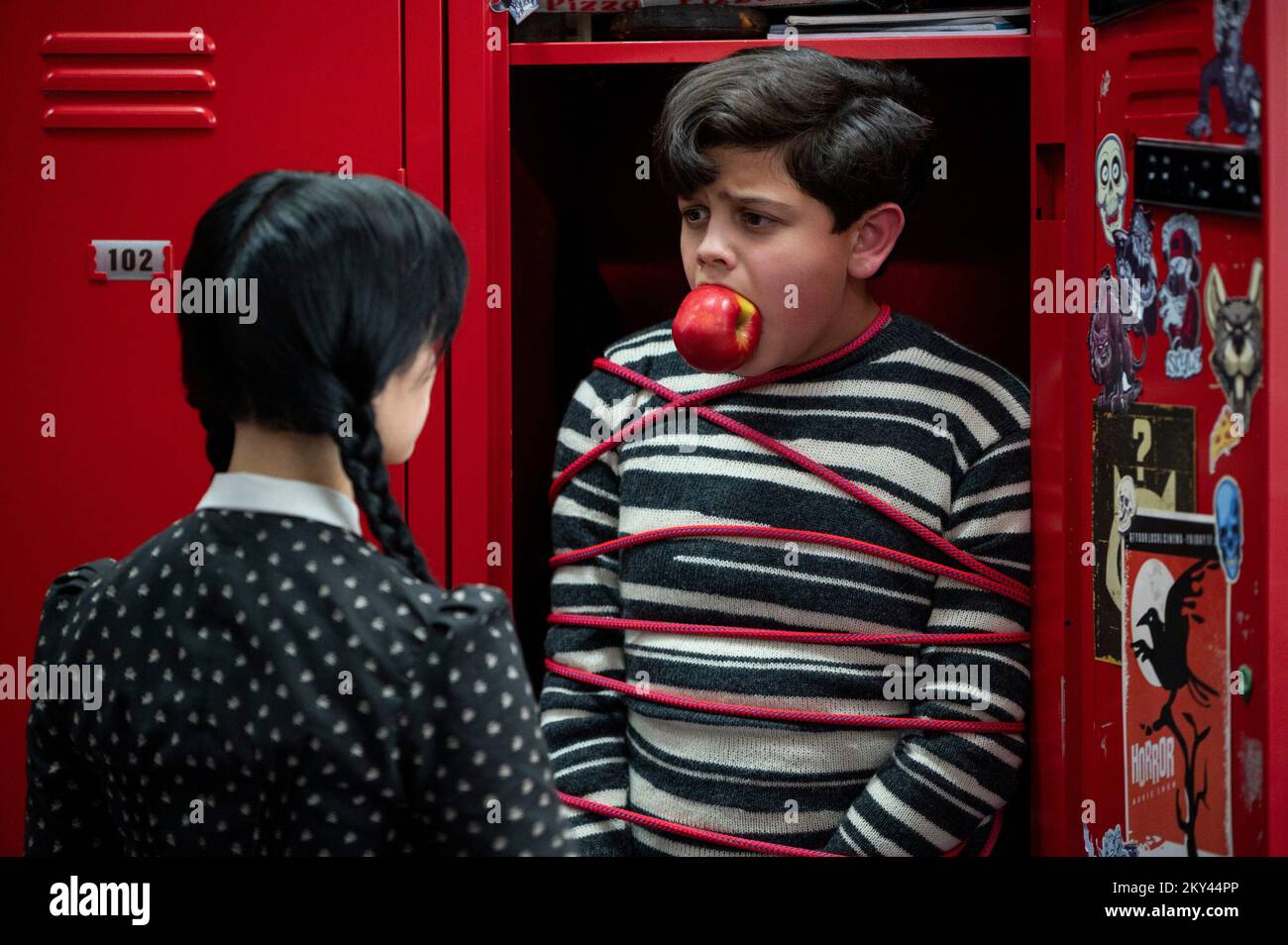 WEDNESDAY, from left: Jenna Ortega (back to camera), Issac Ordonez ...