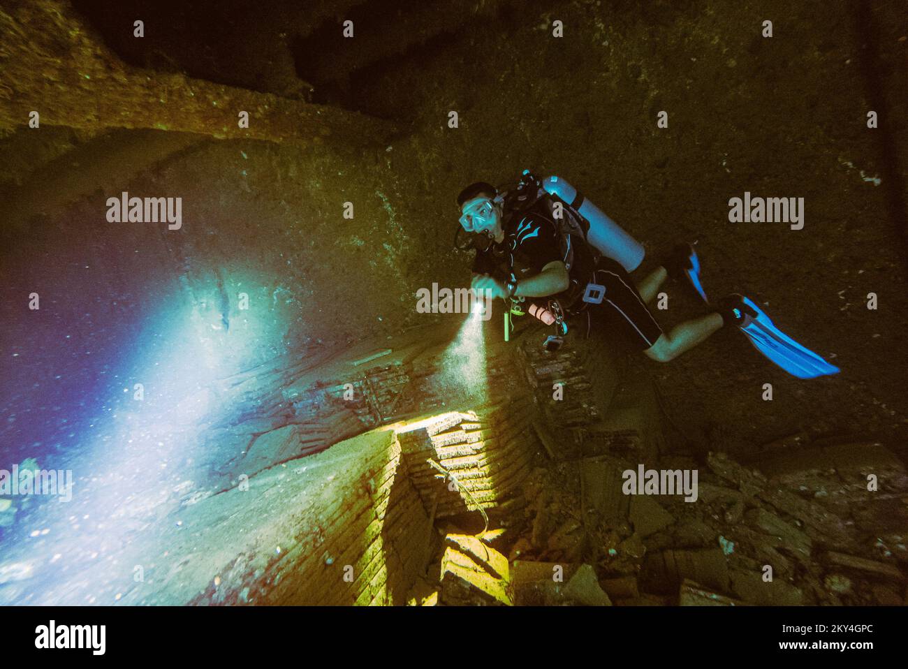 Scuba diver exploring the interior of a shipwreck Chrisoula K on ...