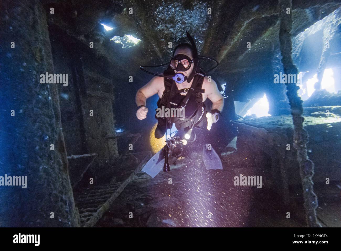 Scuba diver exploring the interior of a shipwreck Chrisoula K on ...