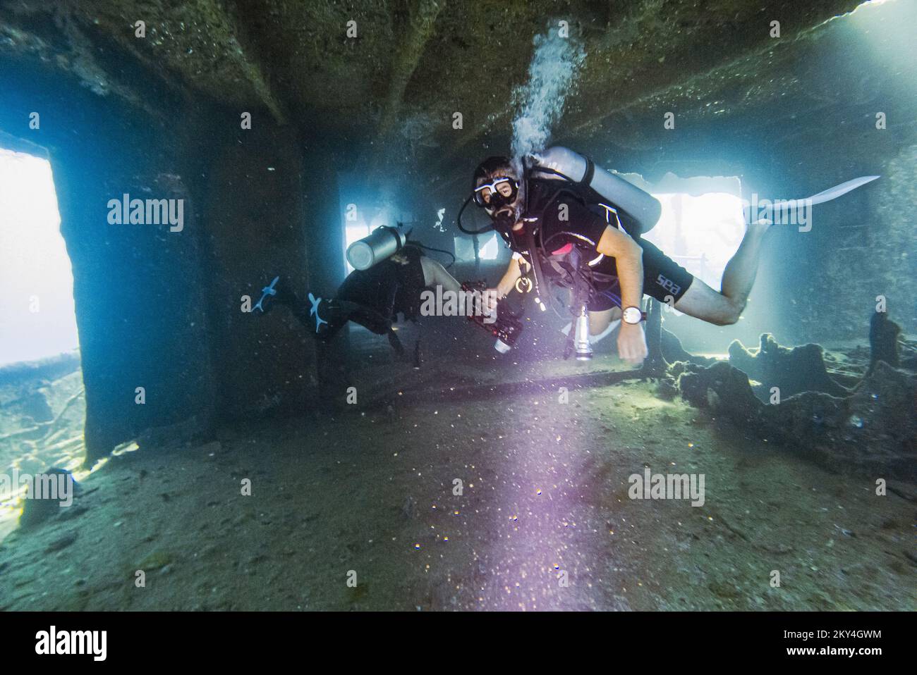 Scuba diver exploring the interior of a shipwreck Chrisoula K on ...