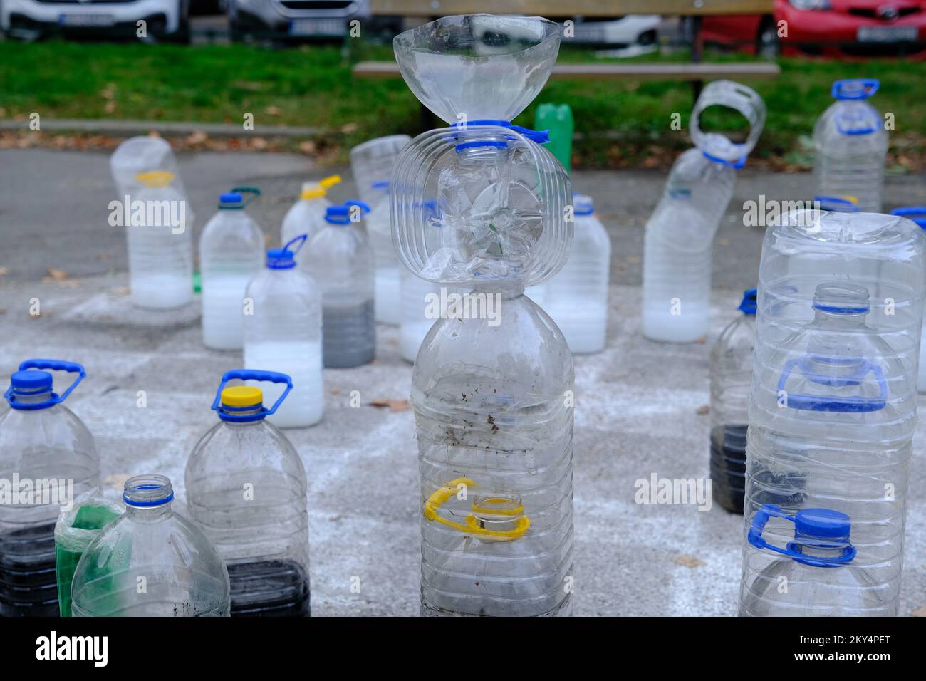 Big chess board of chalk with chess pieces made of plastic bottles seen ...