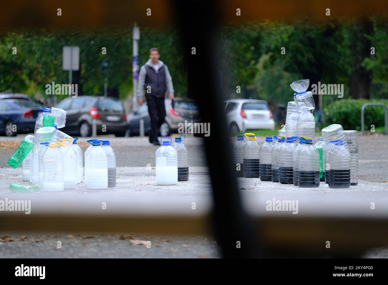 Big chess board of chalk with chess pieces made of plastic bottles seen ...