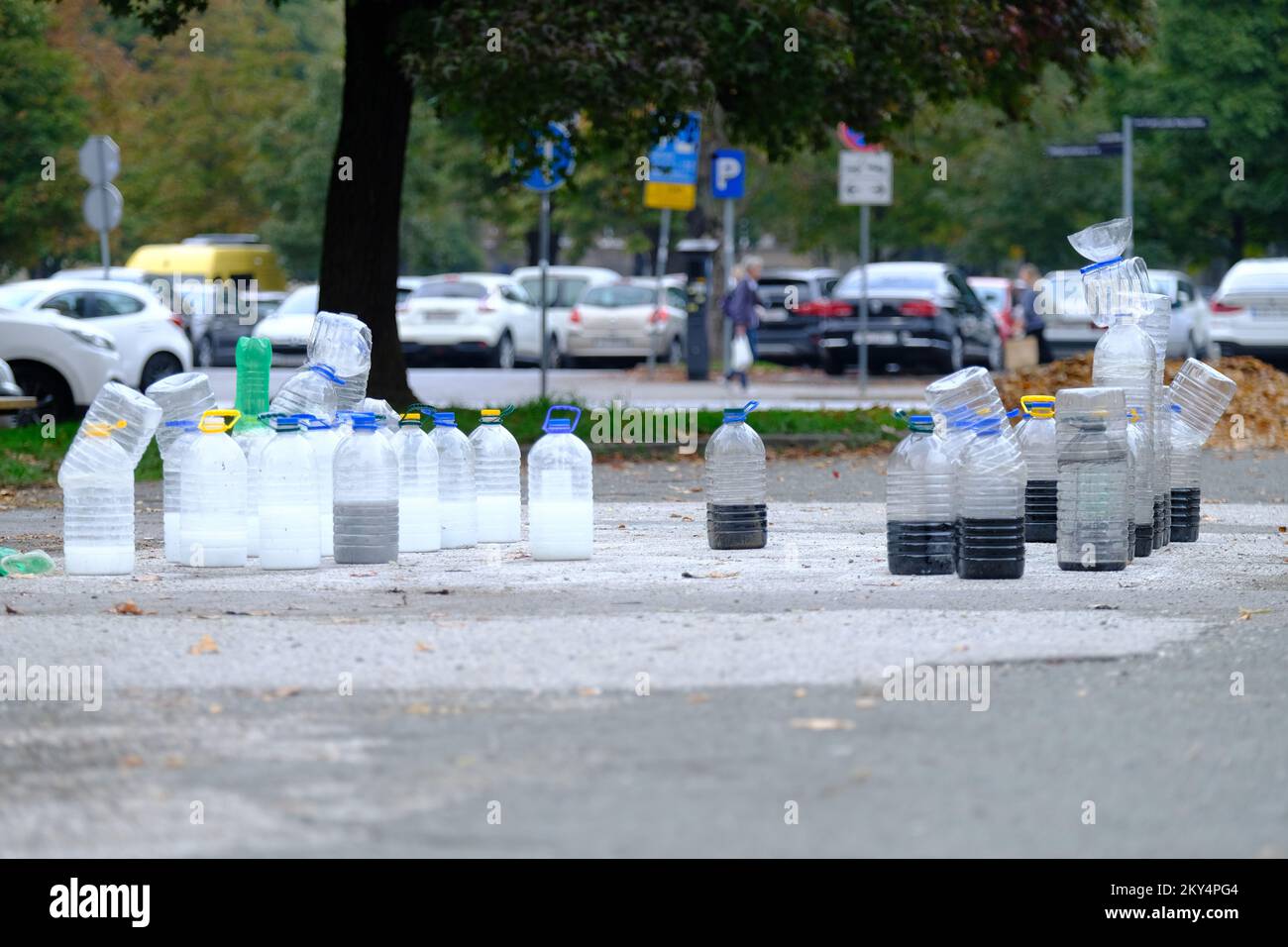 Big chess board of chalk with chess pieces made of plastic bottles seen ...