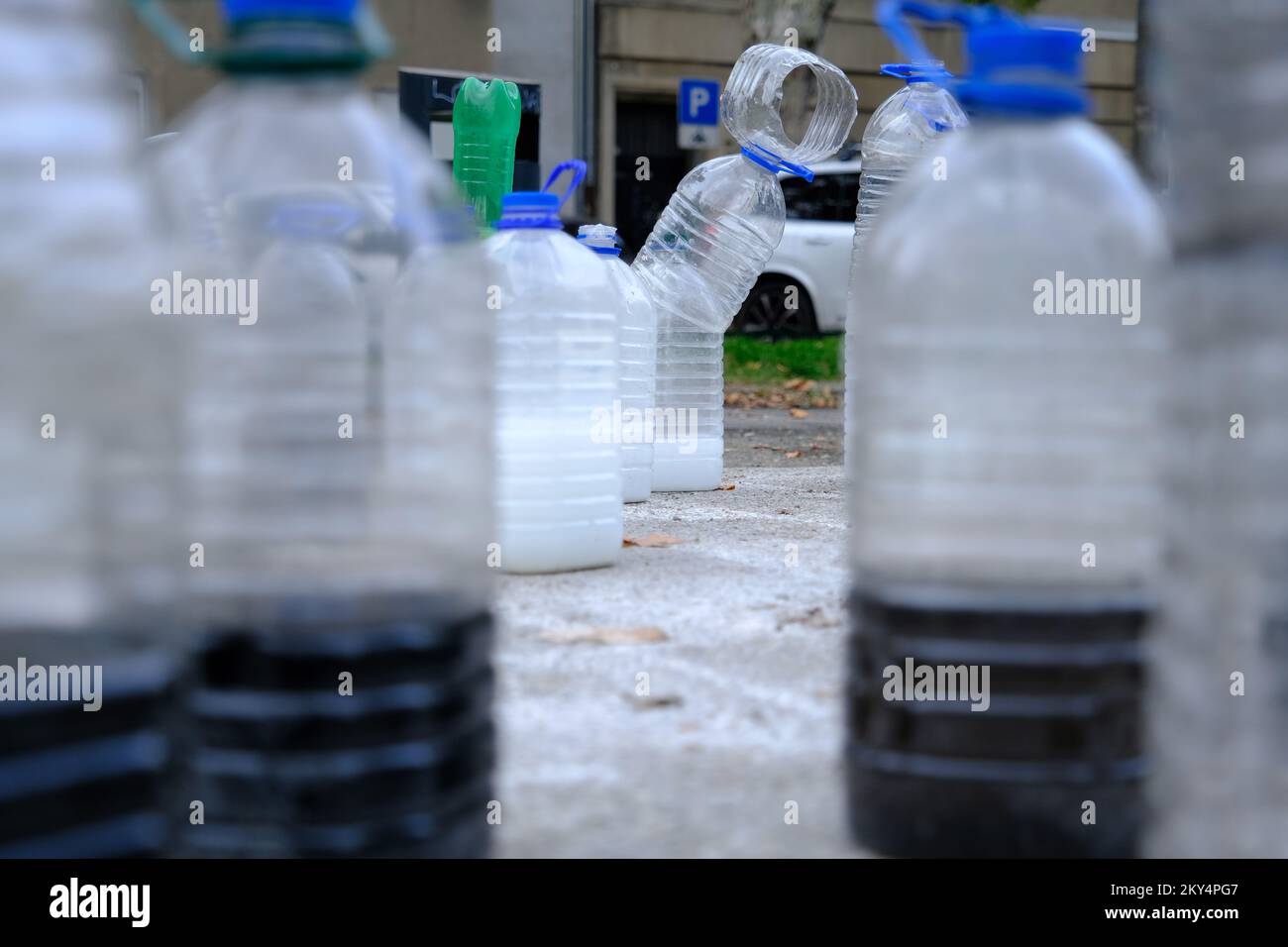 Big chess board of chalk with chess pieces made of plastic bottles seen ...
