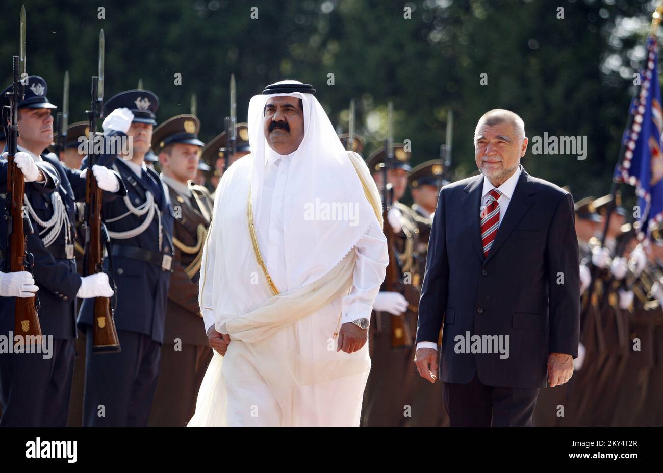 Emir of Qatar Sheikh Hamad bin Khalifa Al-Thani inspects a guard of ...