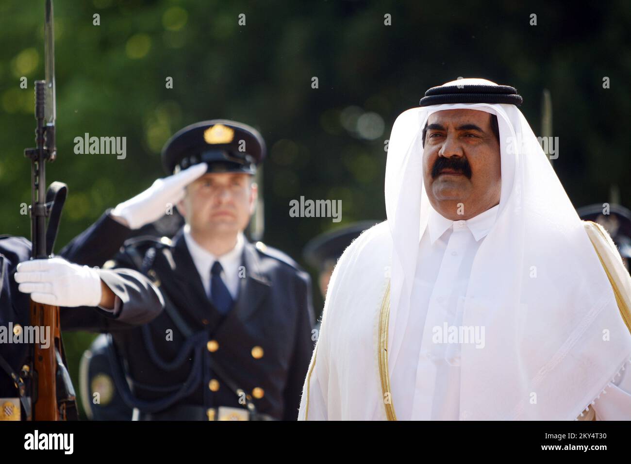 Emir of Qatar Sheikh Hamad bin Khalifa Al-Thani inspects a guard of ...
