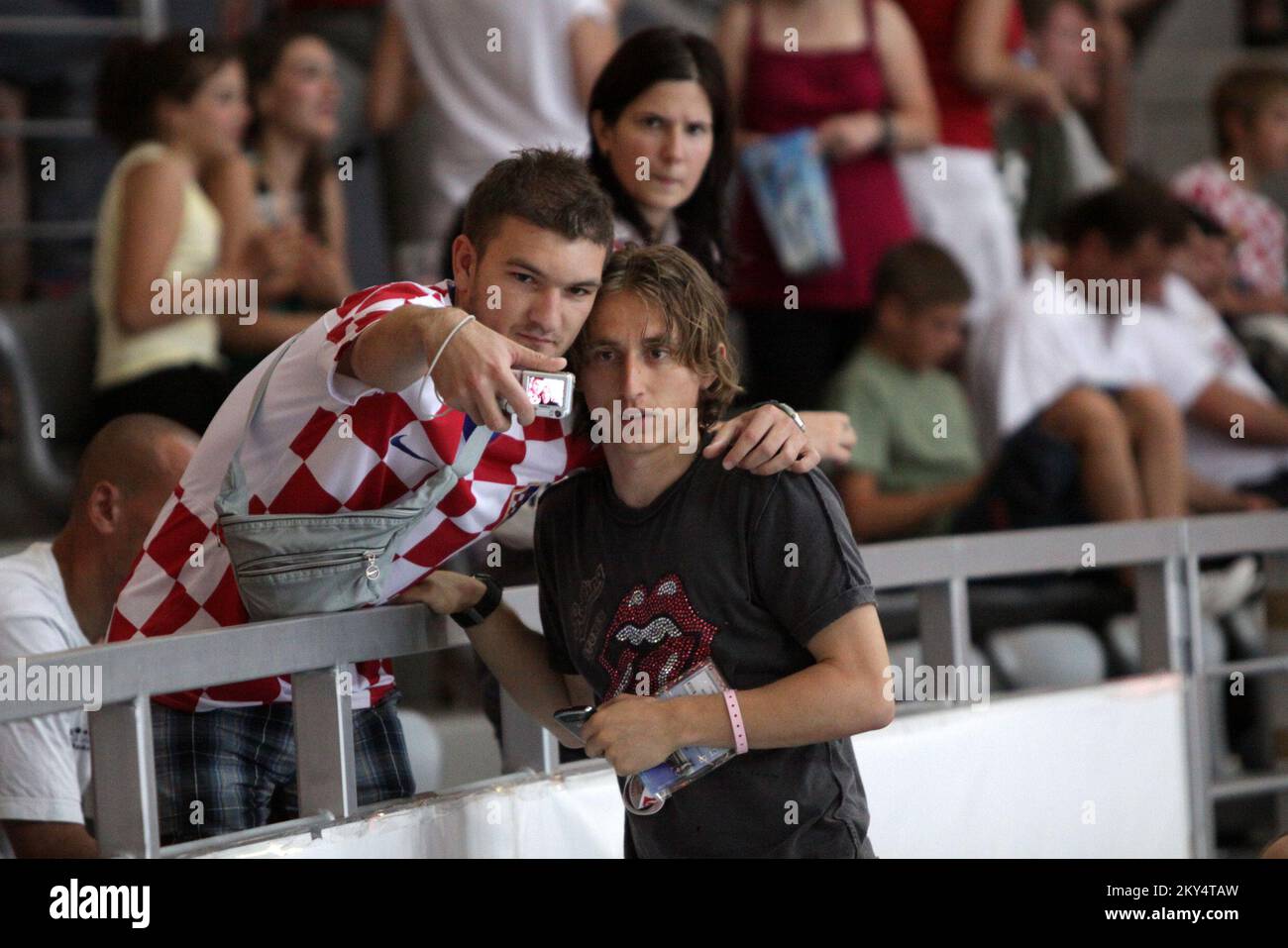 Tottenham Hotspur's Luka Modric poses for a photograph with a fan Stock ...