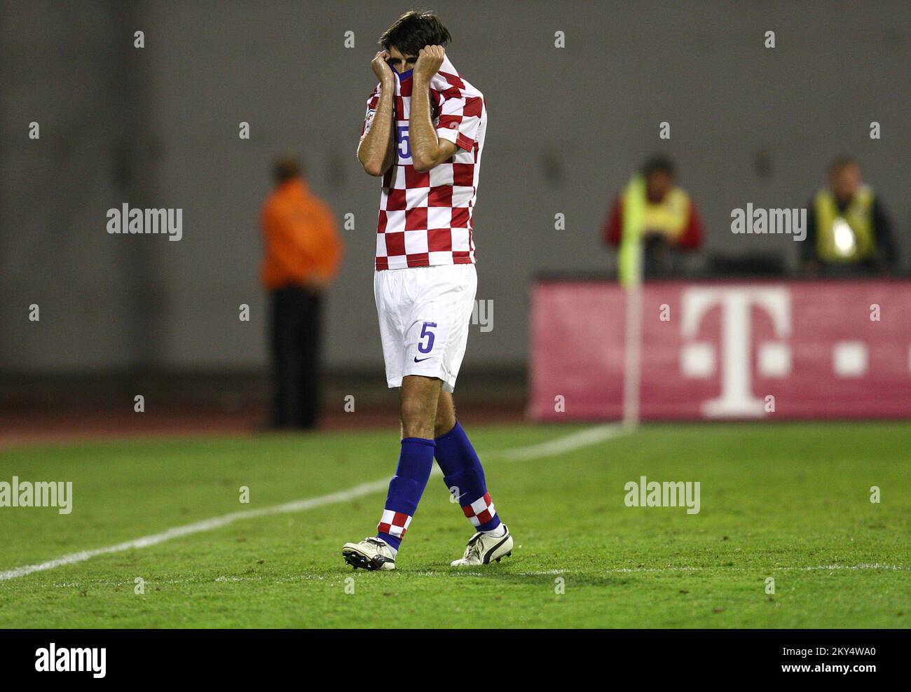 Croatia's Vedran Corluka walks off the pitch after being shown a red ...