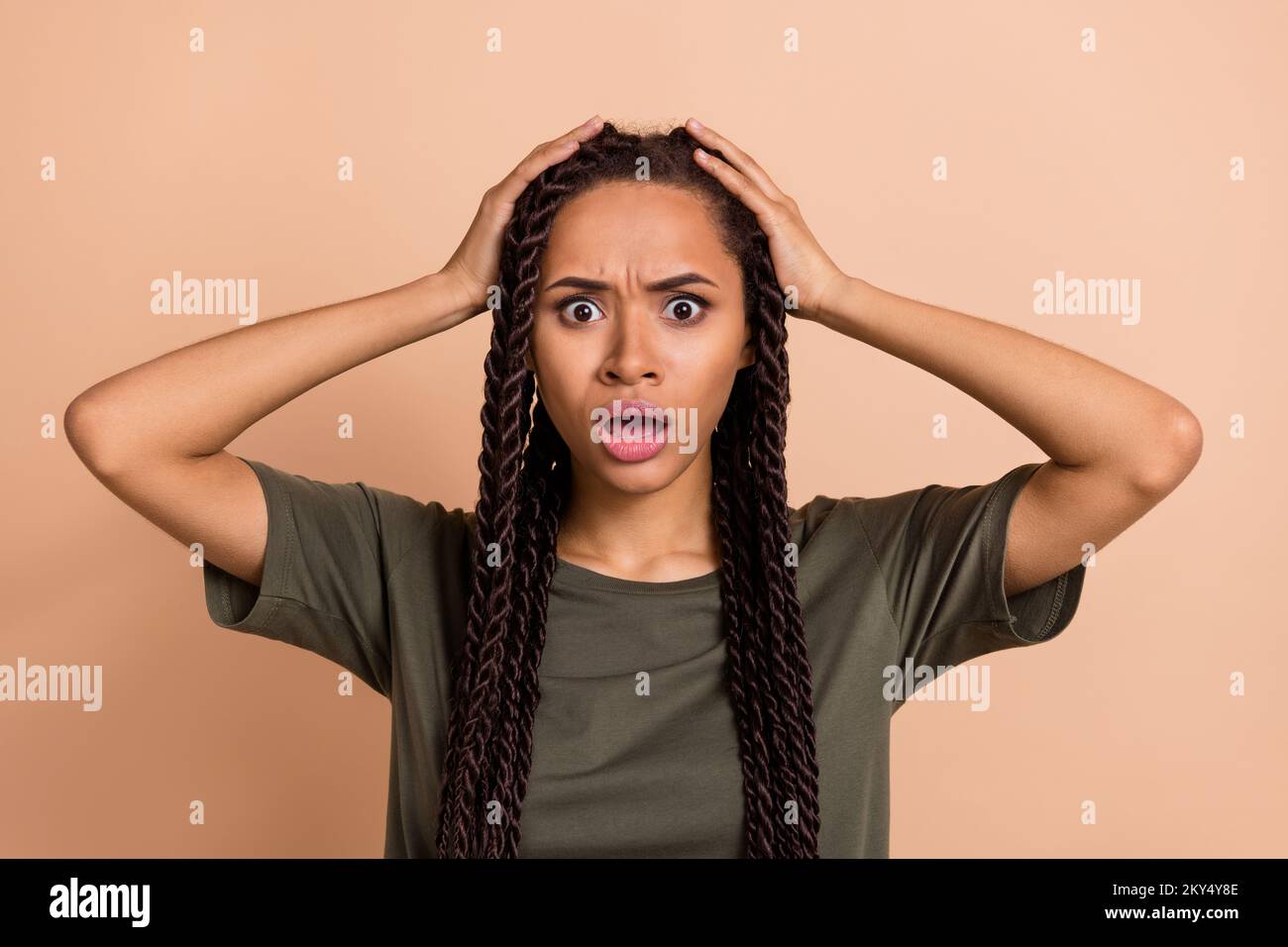 Photo of terrified bad mood female touch head can't believe hear ...