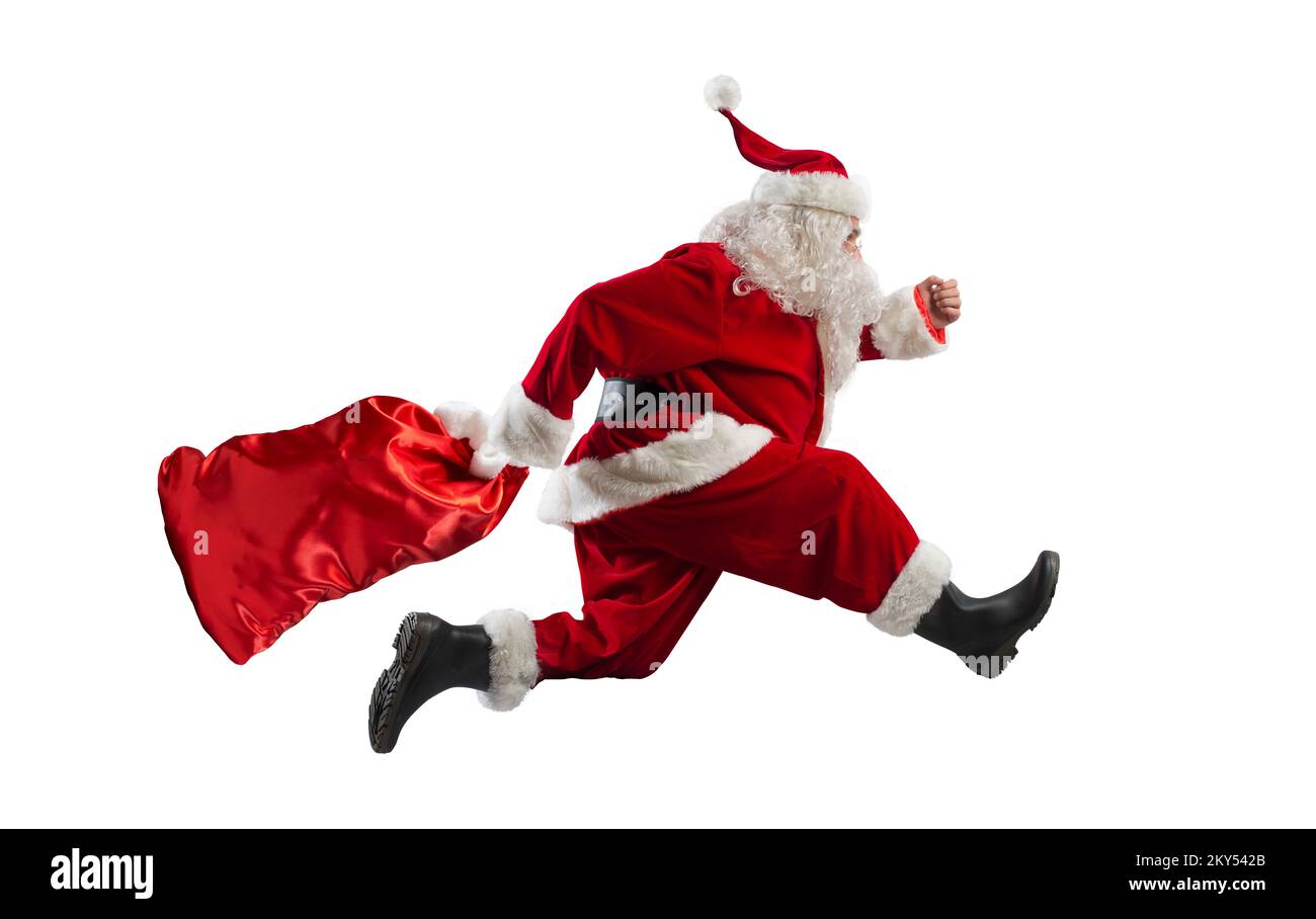 Santa claus runs fast to deliver all gifts Stock Photo - Alamy