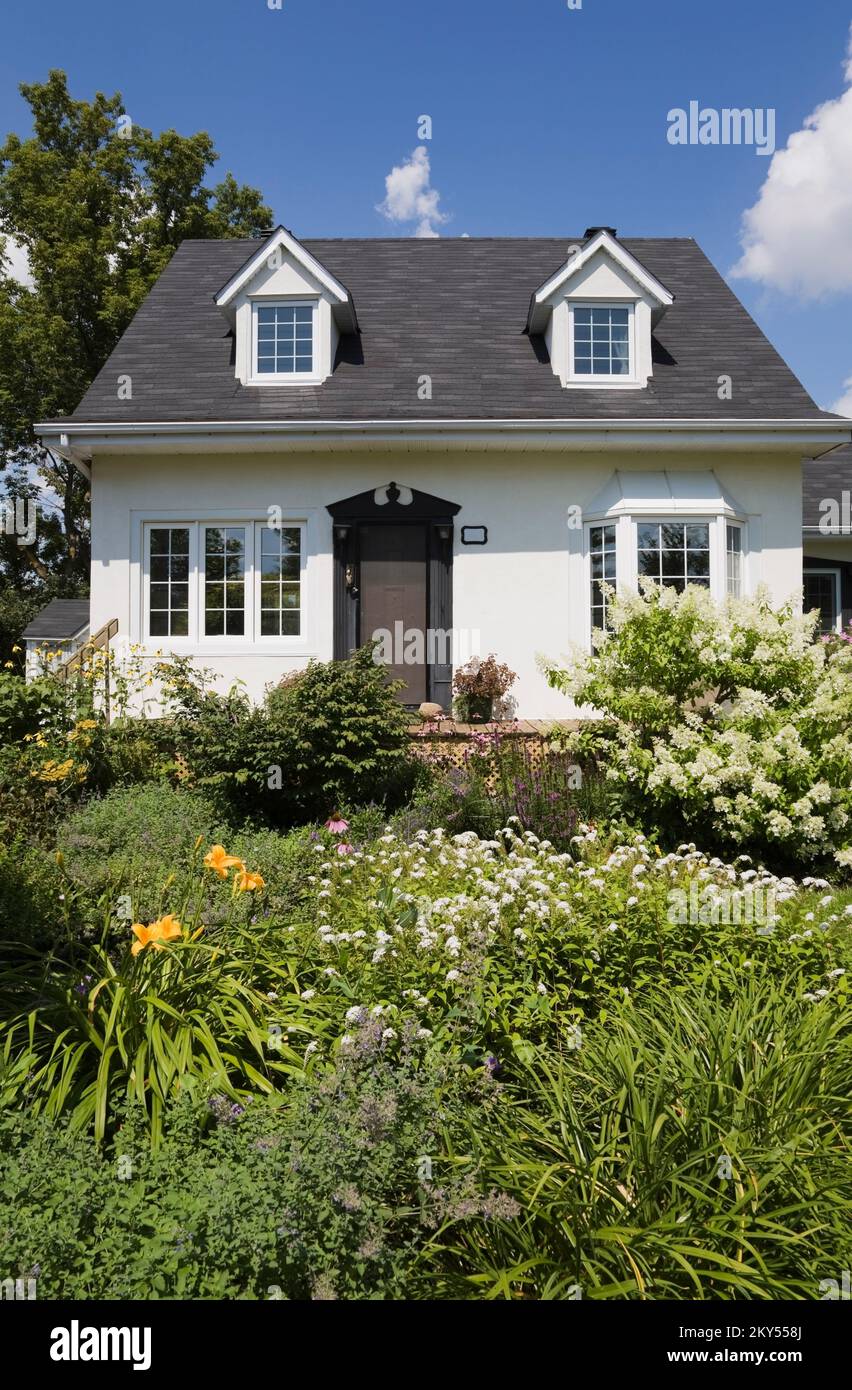 Two storied white with black trim French manor Canadiana style home ...