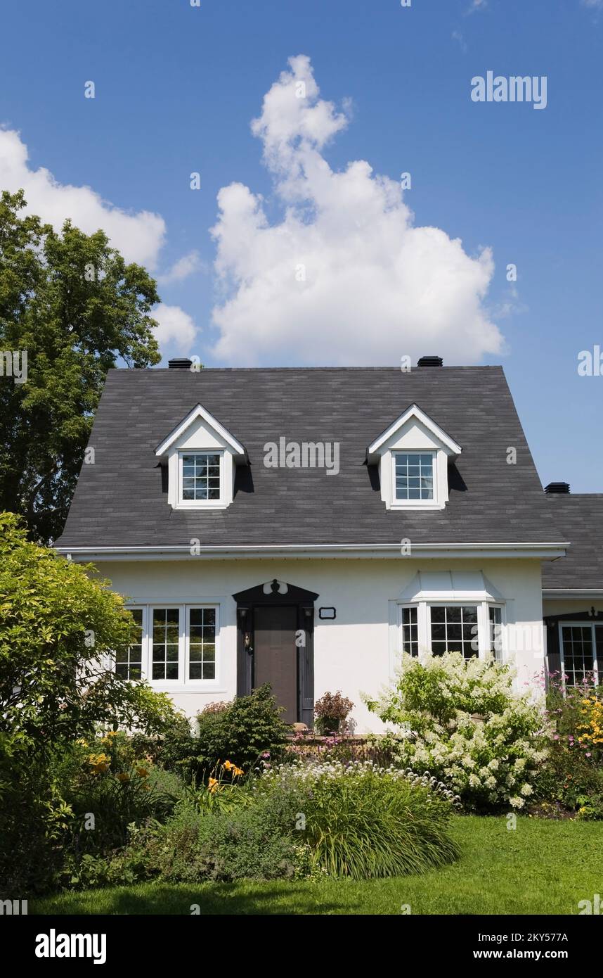 Two storied white with black trim French manor Canadiana style home ...