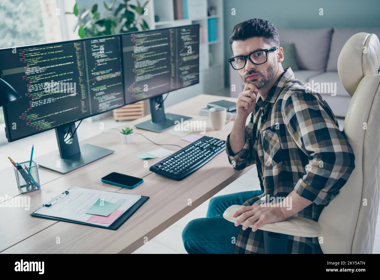 Photo of cool minded guy wear glasses arm hand chin creating software ...