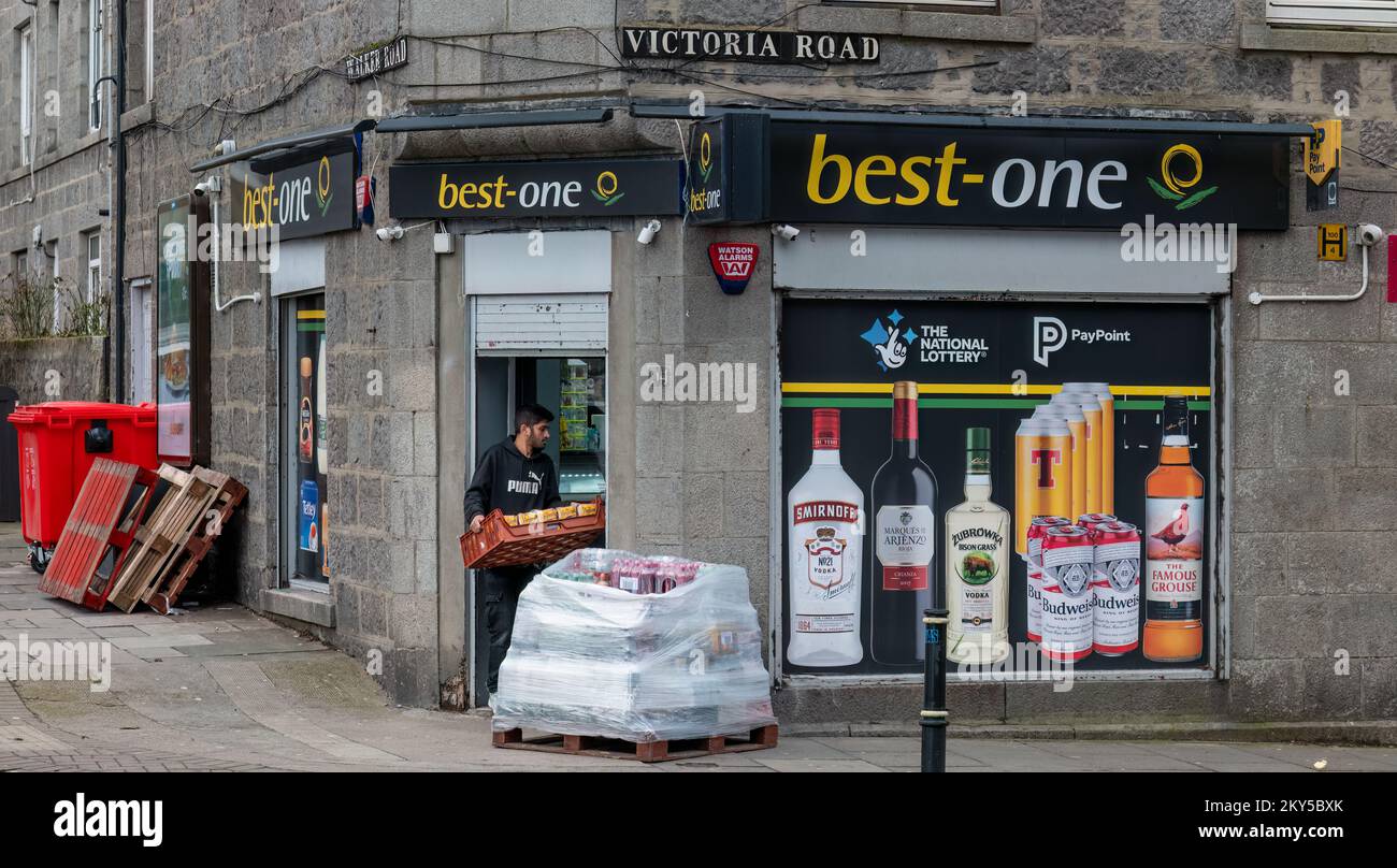 25 November 2022. Aberdeen, Scotland. This is a male worker unpacking a ...
