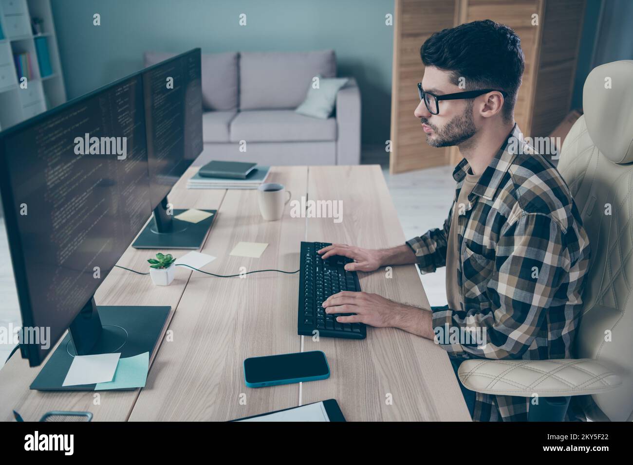 Photo of busy serious programmer wear spectacles developing application ...