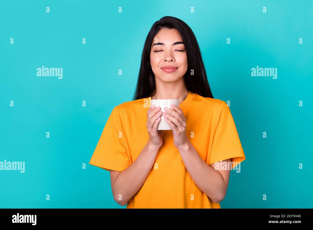 Photo of rest millennial lady smell tea wear orange t-shirt isolated on ...