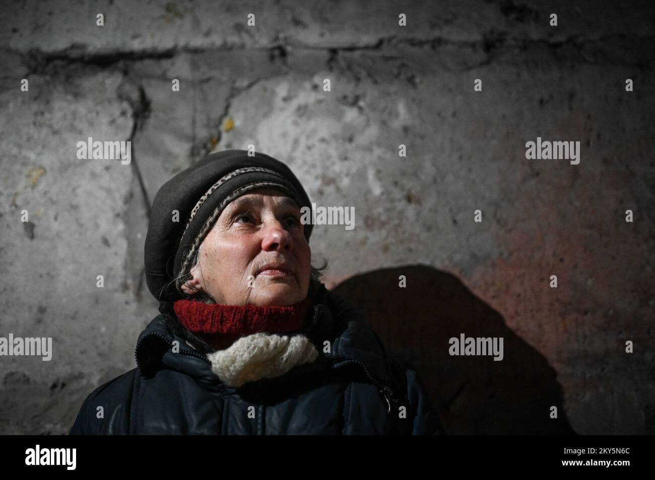 Vera, 72, a local resident sits on her bed in a basement shelter in ...