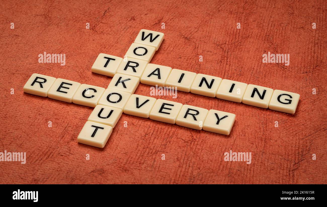 workout, training and recovery crossword in ivory letter tiles against ...