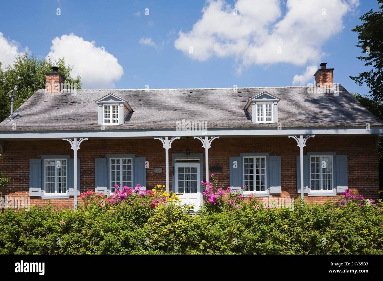 Old 1858 red nuanced brick home with gray, white trim. long veranda and ...