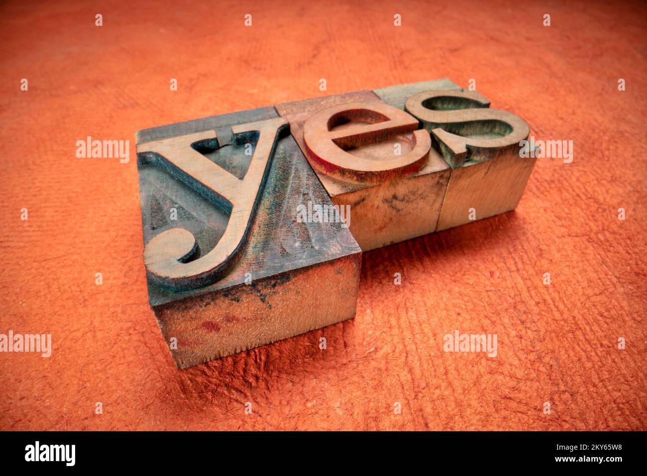 yes - word in wooden letterpress printing blocks, stained by dark color ...