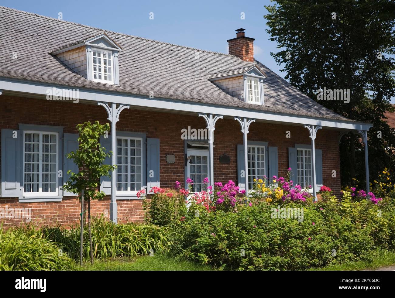Old 1858 red nuanced brick home with gray, white trim. long veranda and ...