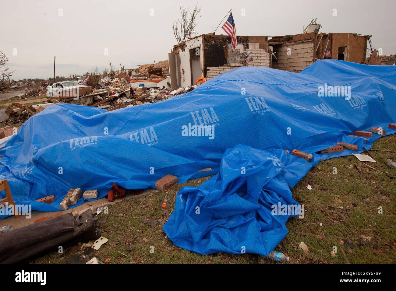Moore, Okla., May 23, 2013 A FEMA issued tarp is used to cover personal ...