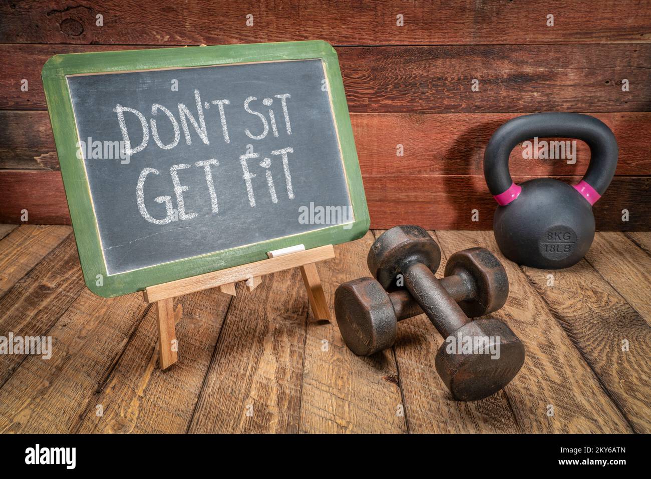 do not sit, get fit - white chalk text on a slate blackboard sign ...