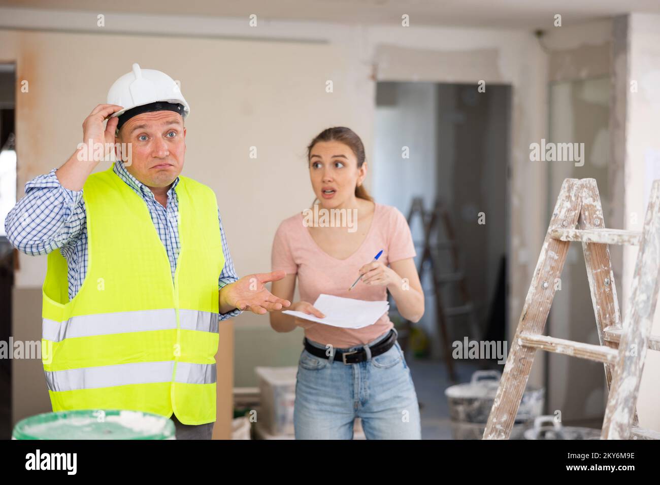 Work conflict between woman and contractor Stock Photo - Alamy