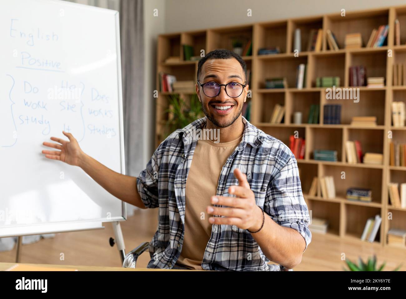 English course. Arab male teacher having foreign language class sitting ...