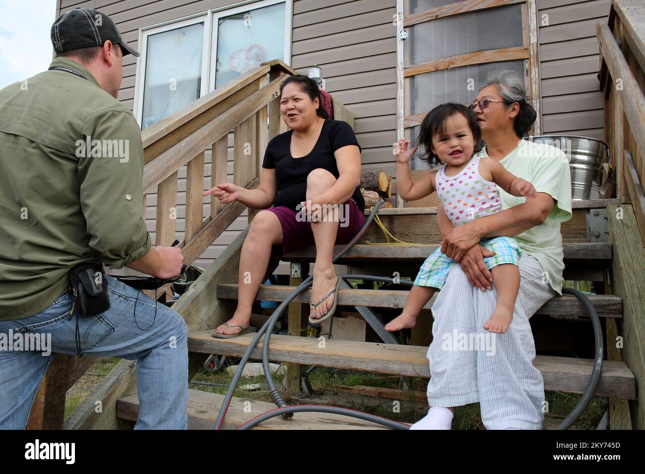 Fort Yukon, Alaska, July 7, 2013 FEMA inspector Jeff Smith is working ...