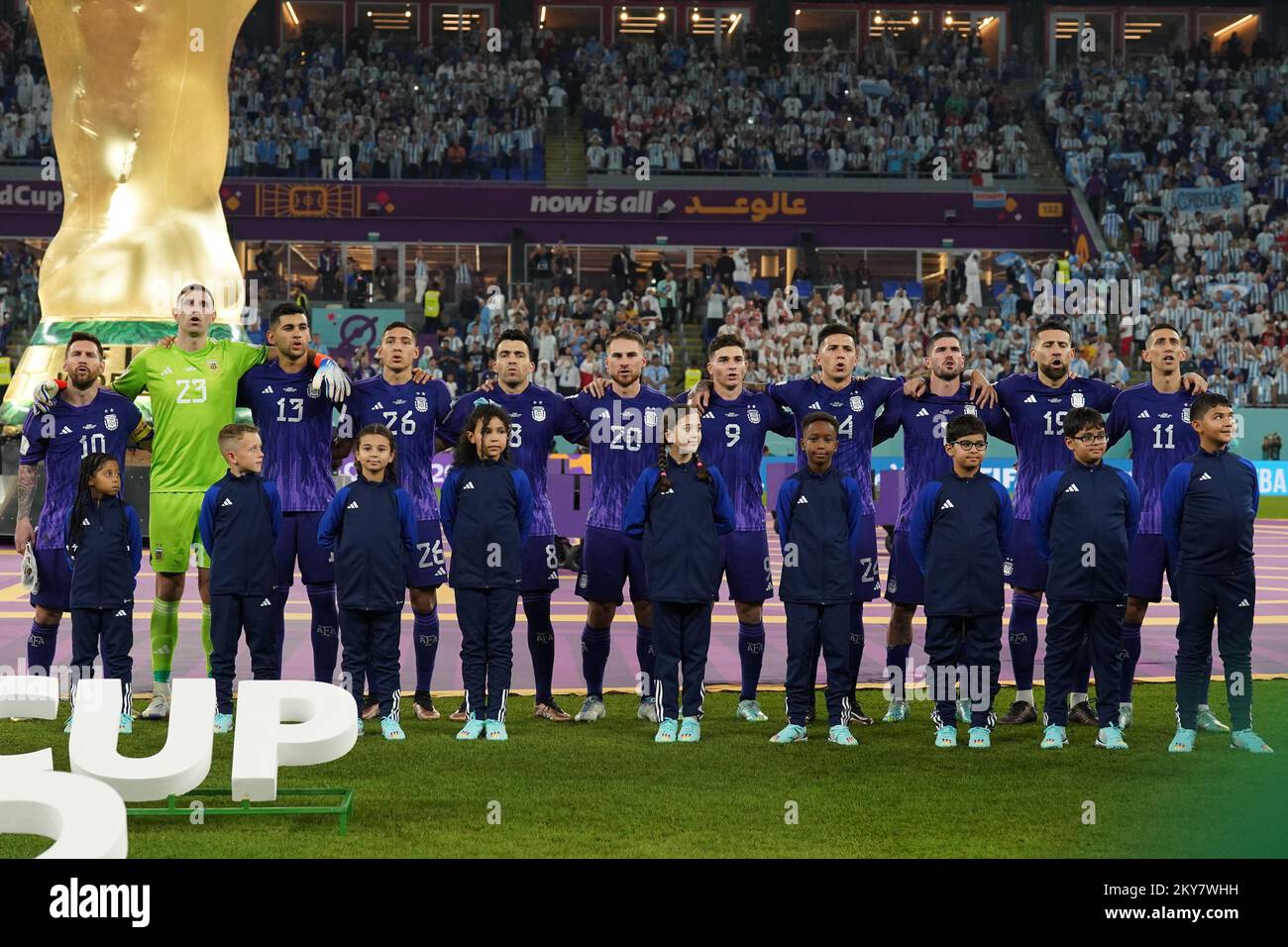 DOHA, QATAR - NOVEMBER 30: (L-C-R) Players of Argentina sing the ...