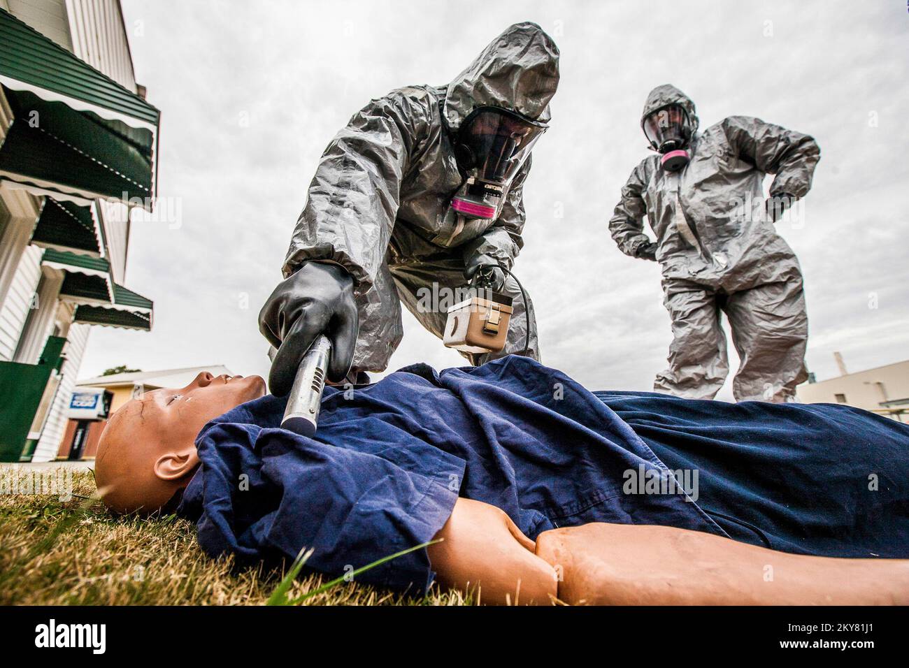 Emergency response personnel check for radiological activity on a ...