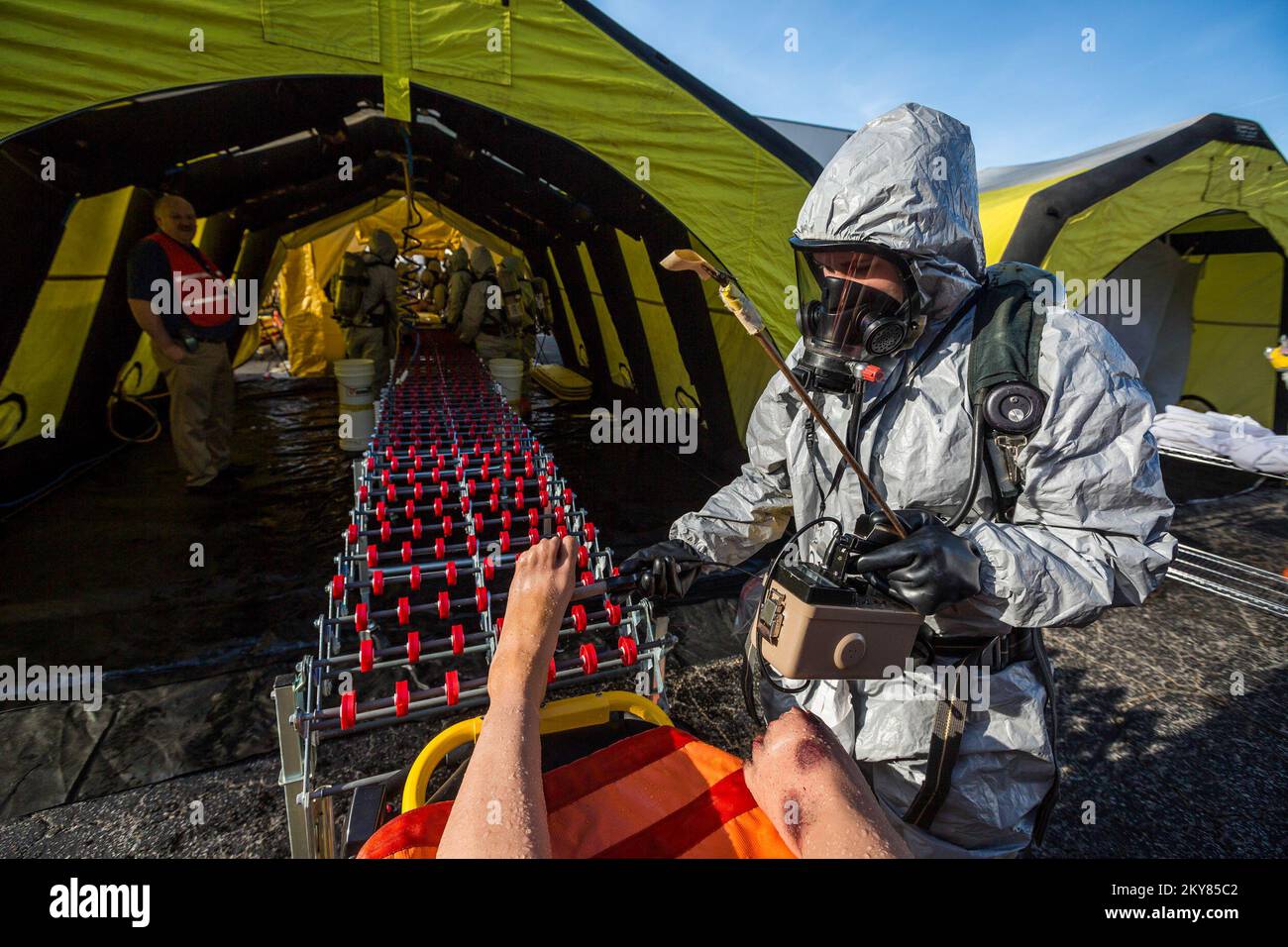 Emergency response personnel check for radiological activity on a ...