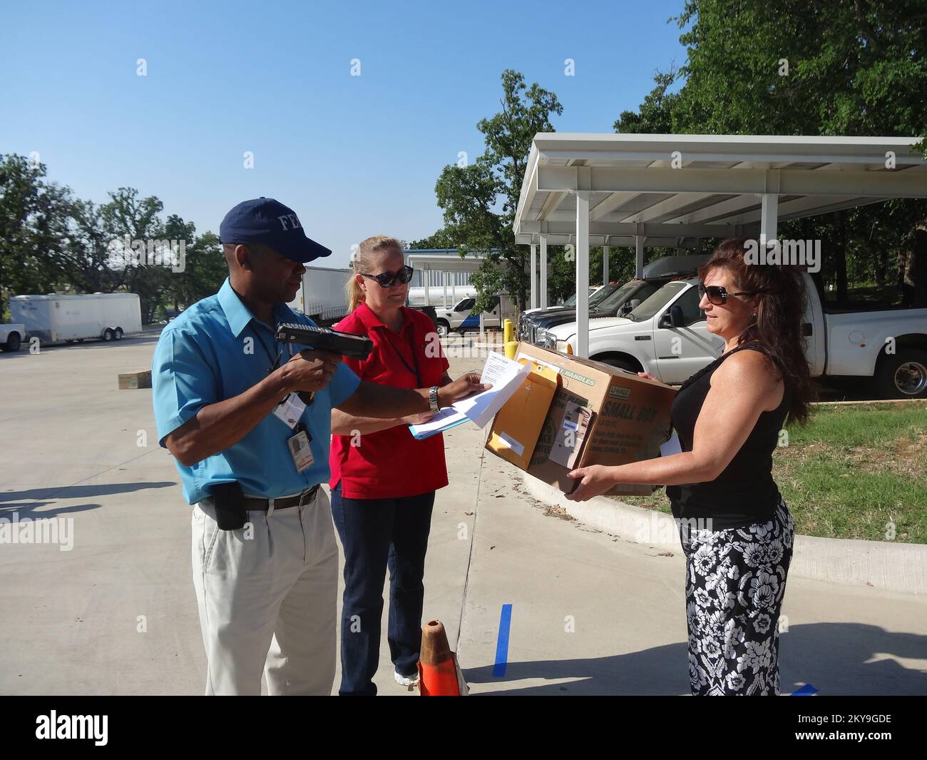 LSCMS Specialist scanning the packing slip over Wi-Fi.. Photographs ...