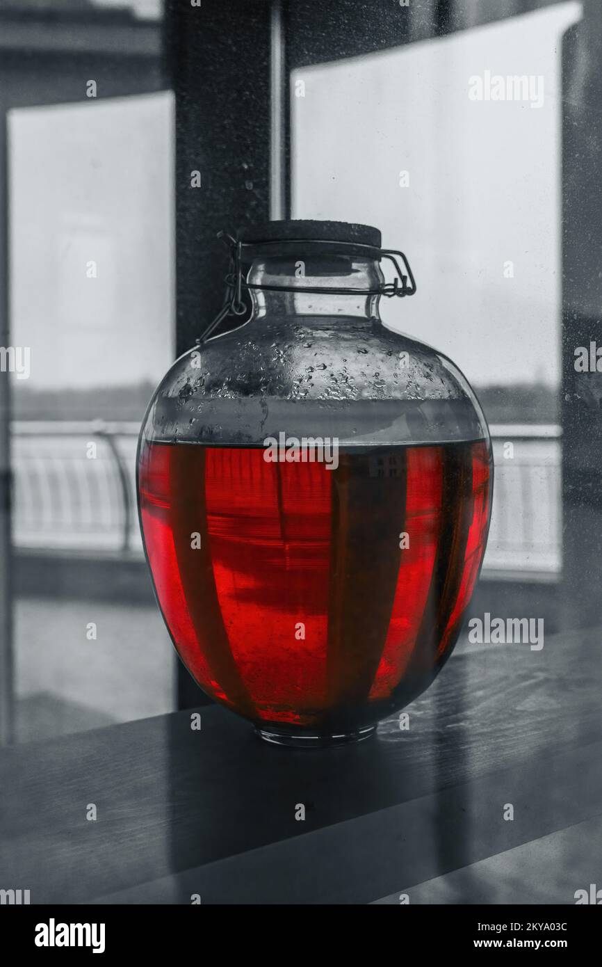 red liquid in a glass container Stock Photo - Alamy