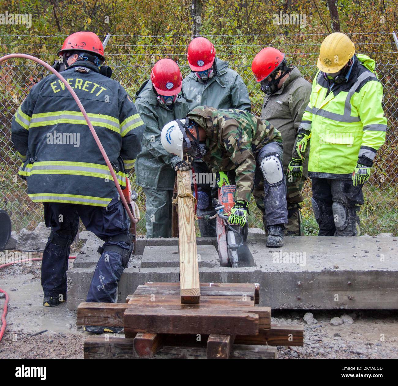 A MA-TF1 team member cuts through concrete with a K-12 rescue saw ...
