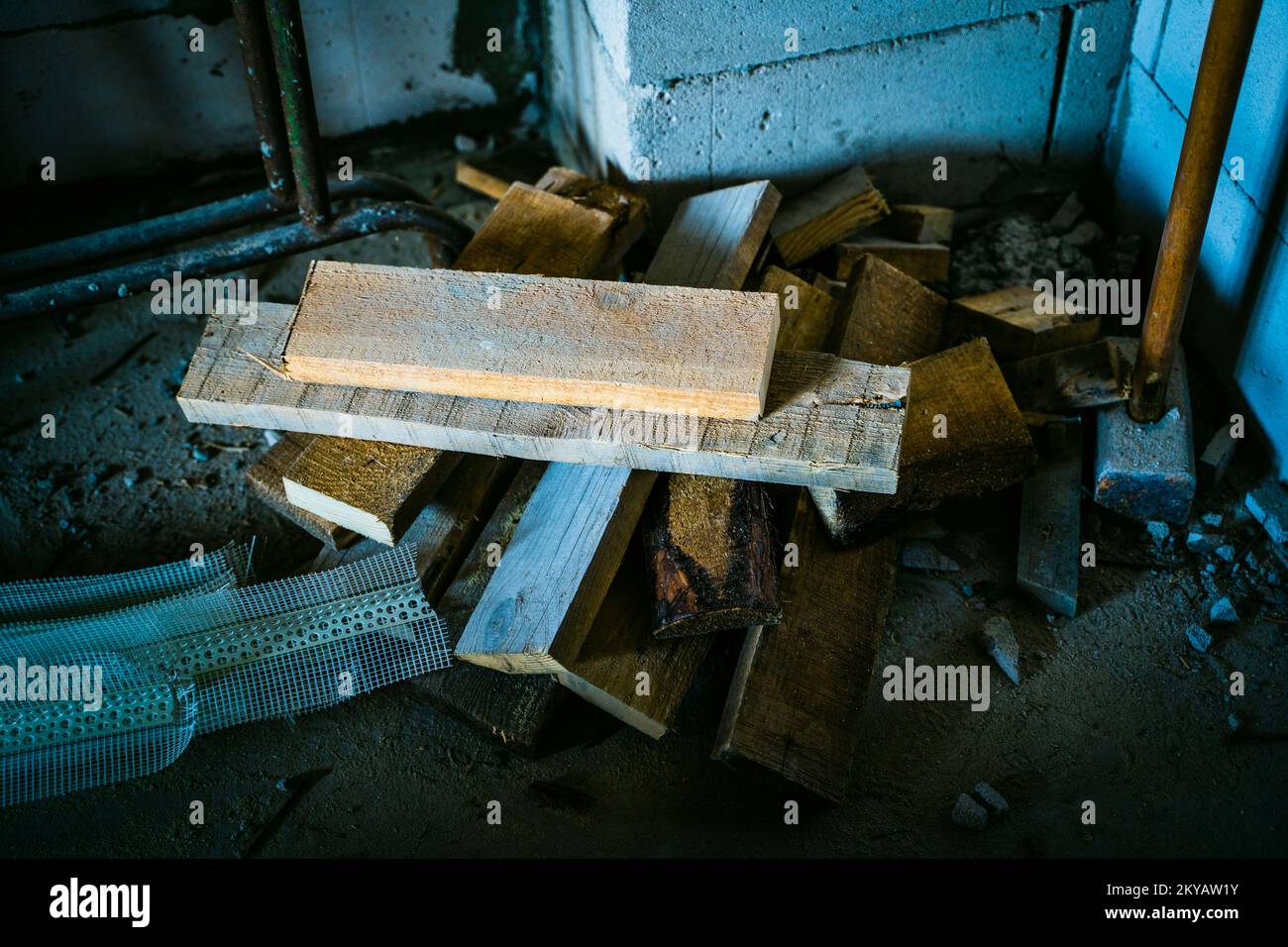 Different building materials lie on the floor in an unfinished house ...