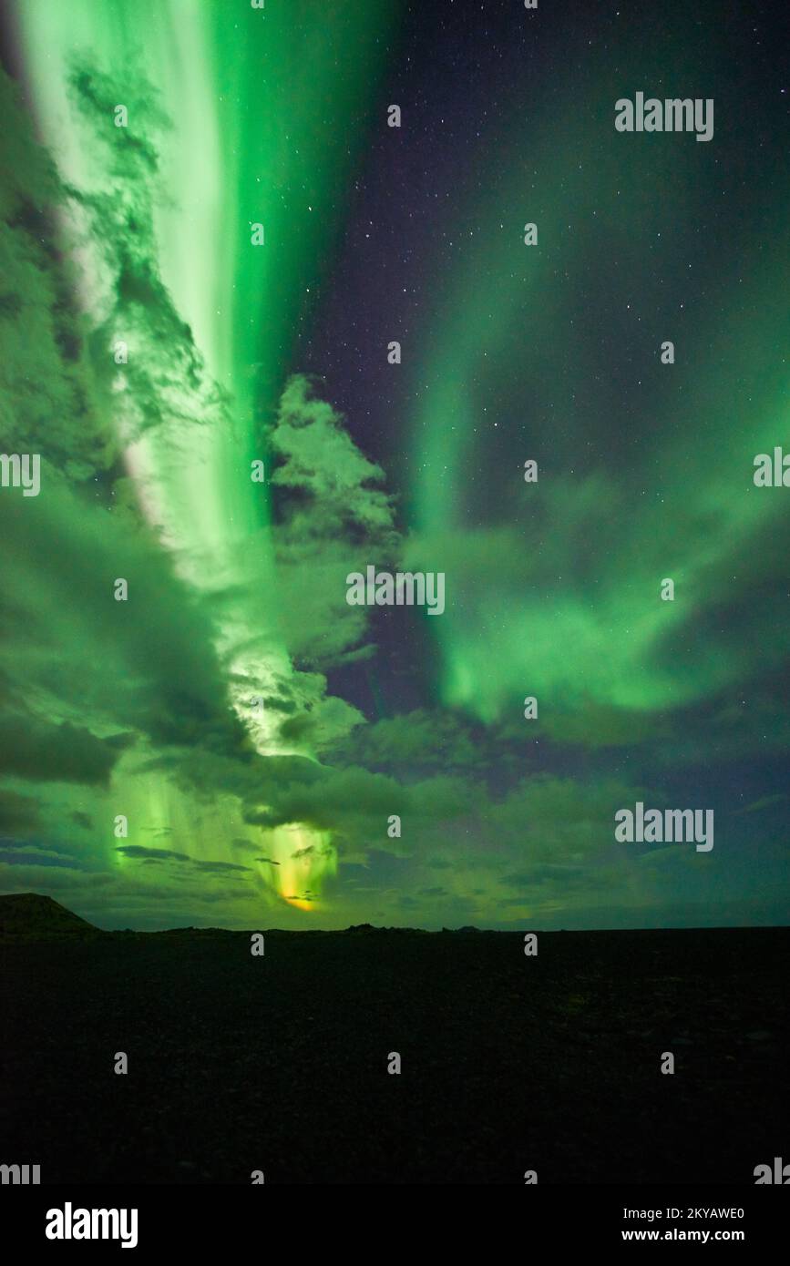 Auroras dance over the Snæfellsnes Peninsula, painting the night sky ...