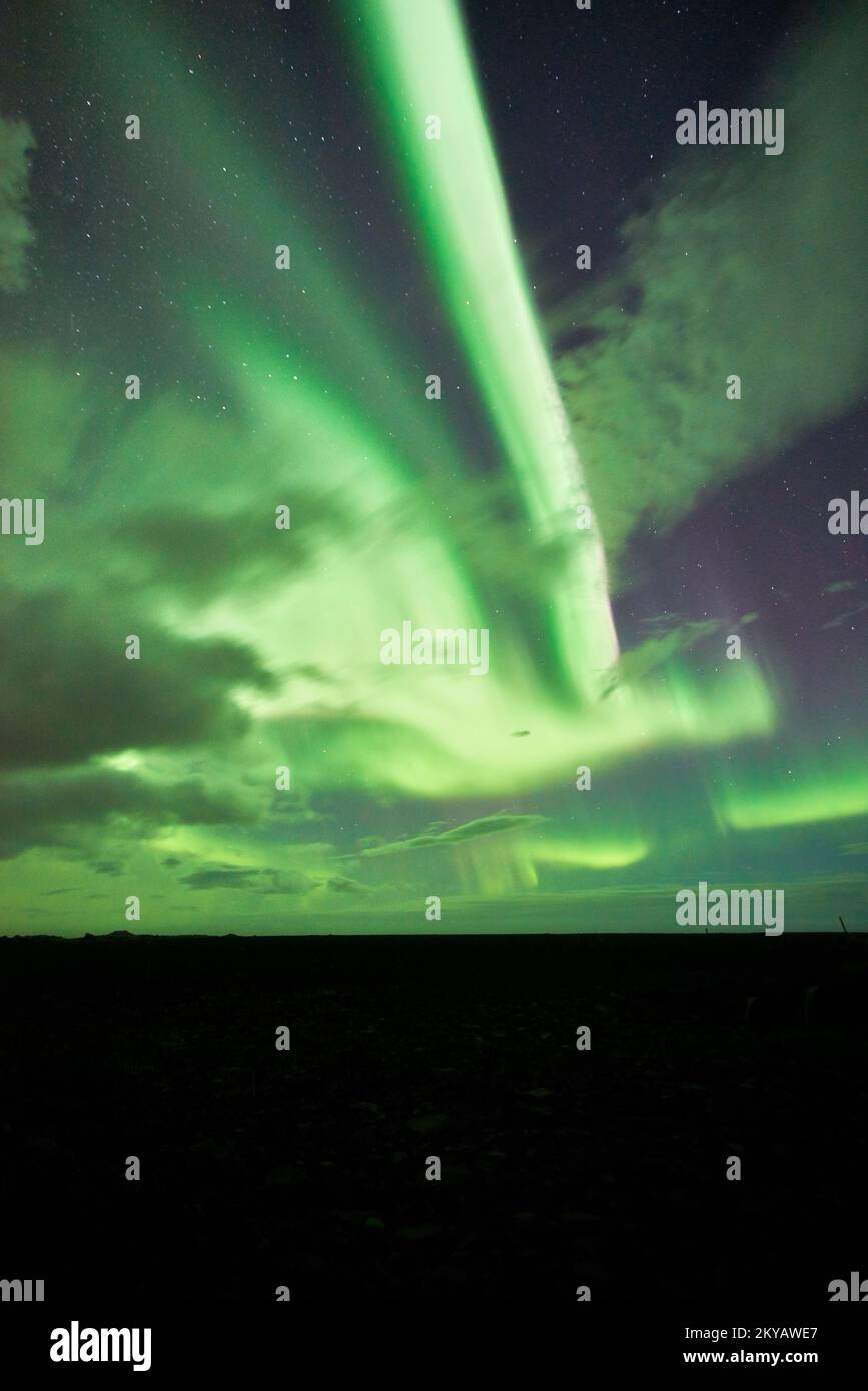 Auroras dance over the Snæfellsnes Peninsula, painting the night sky ...
